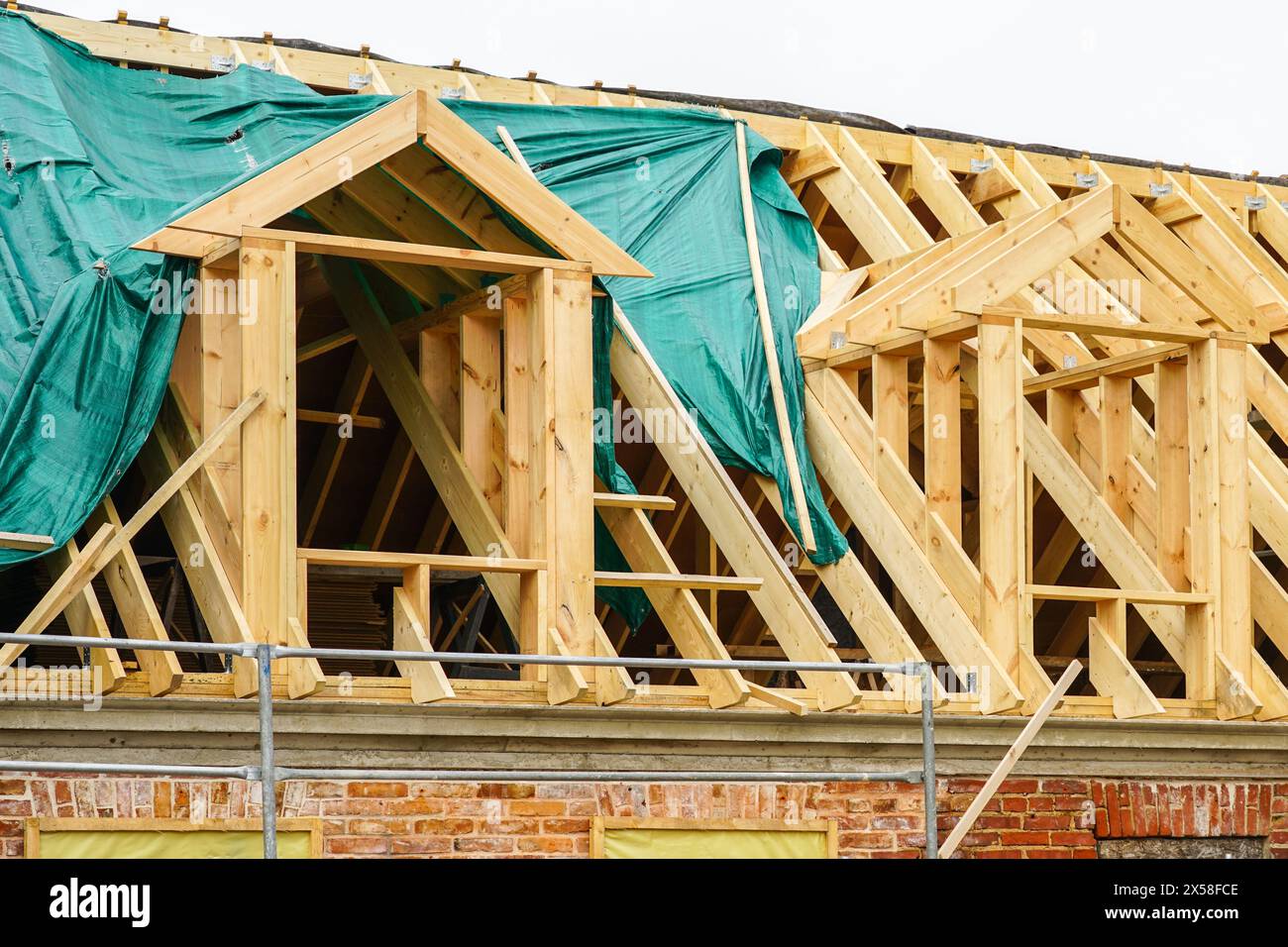 Reconstruction of an old brick house, replacement of wooden roof ...