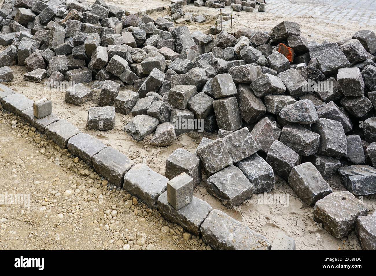 Street paving with historical hammered cubes shape granite paving ...