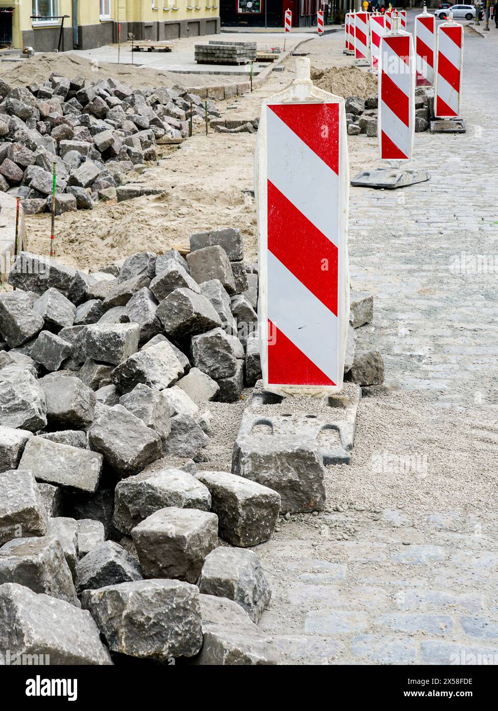 Street paving with historical hammered granite paving stones, city ...