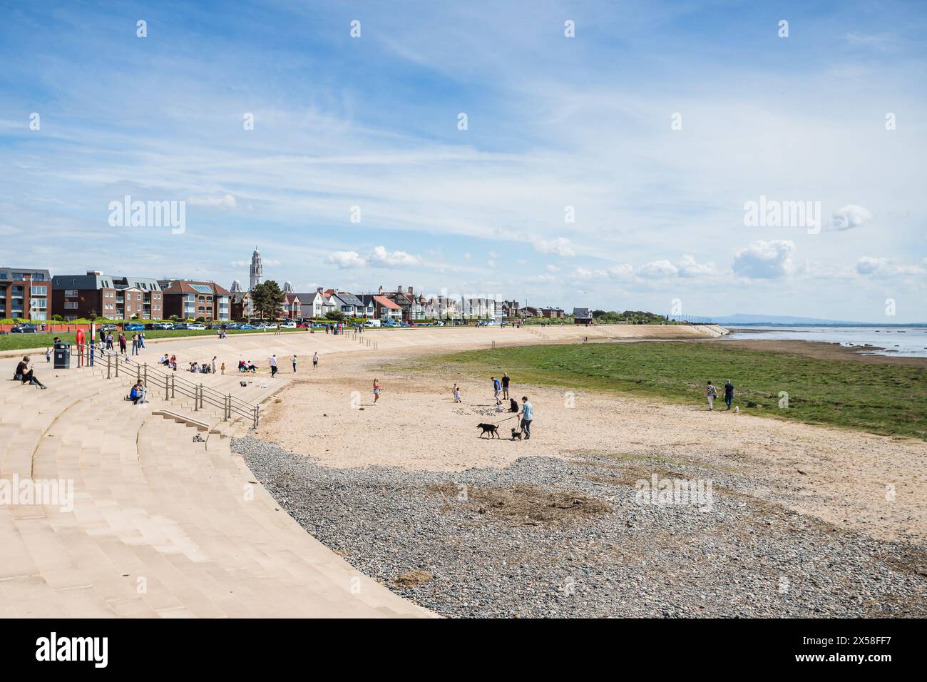 Tourists seen on the beach and steps of Lytham on the Flyde coast in ...