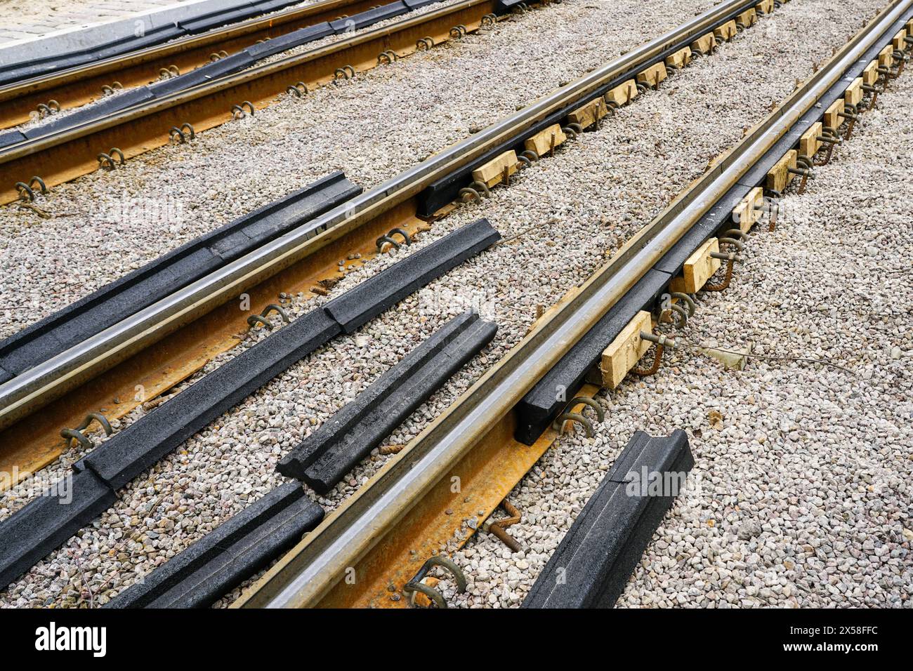 Attaching black polyurethane pads to new tram rails to reduce vibration ...