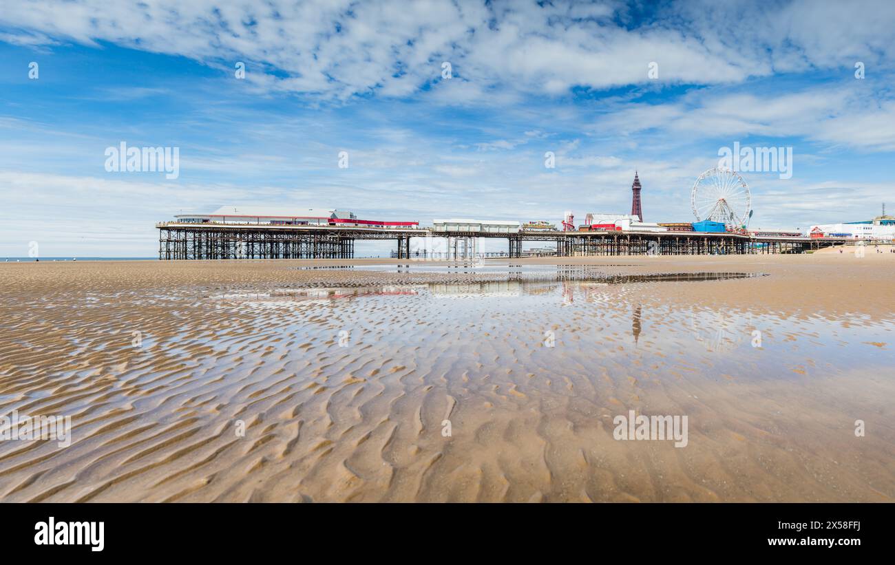 Central Pier reflecting in a tidal pool on the beach at Blackpool ...