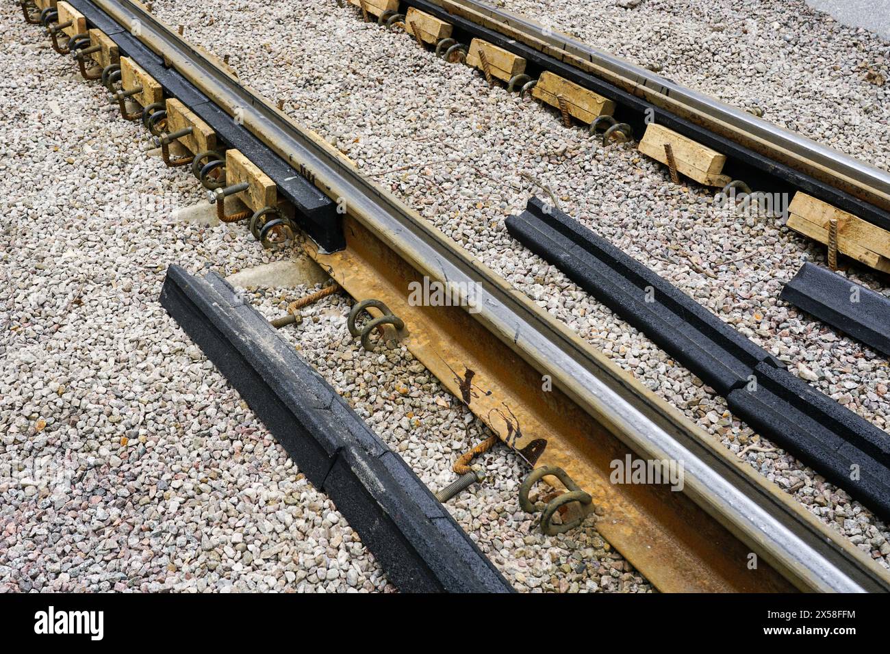 Attaching black polyurethane pads to new tram rails to reduce vibration ...