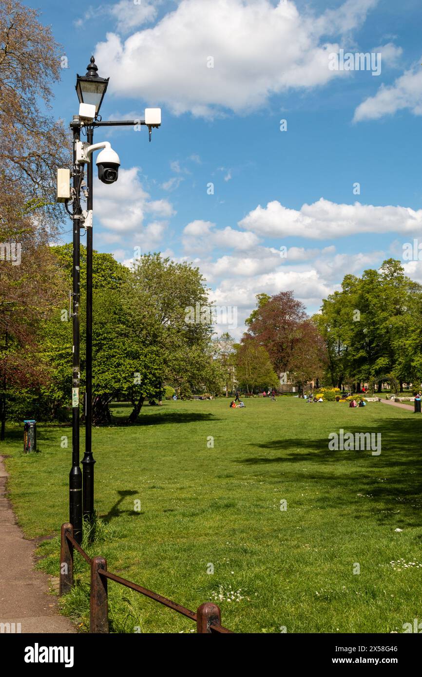 CCTV, surveillance cameras and equipment installed on a pole against a ...
