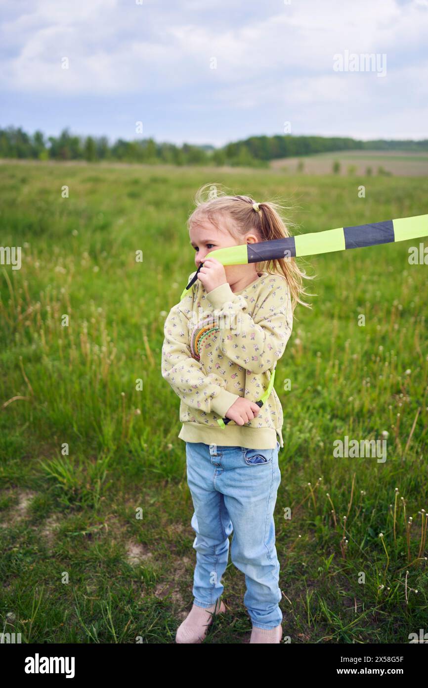 little girl got tangled in a kite's tail Stock Photo - Alamy