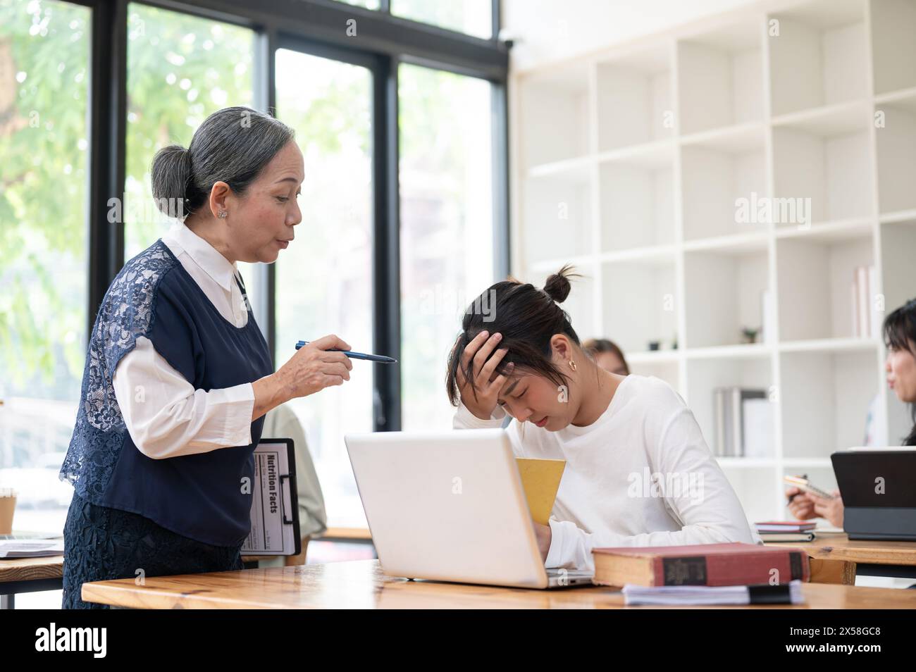 Young student struggle to understand the lesson while teacher trying to ...