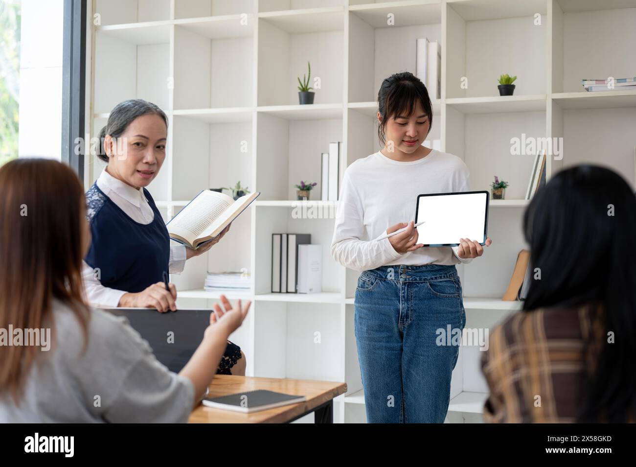 Teacher presenting project classroom hi-res stock photography and ...