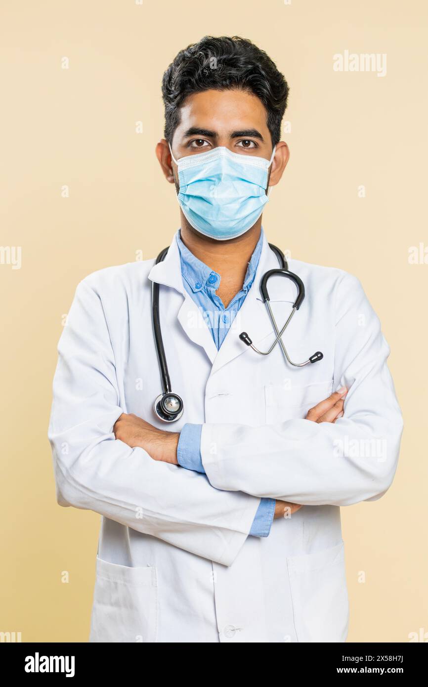 Indian doctor cardiologist man wearing medical mask on face protection ...