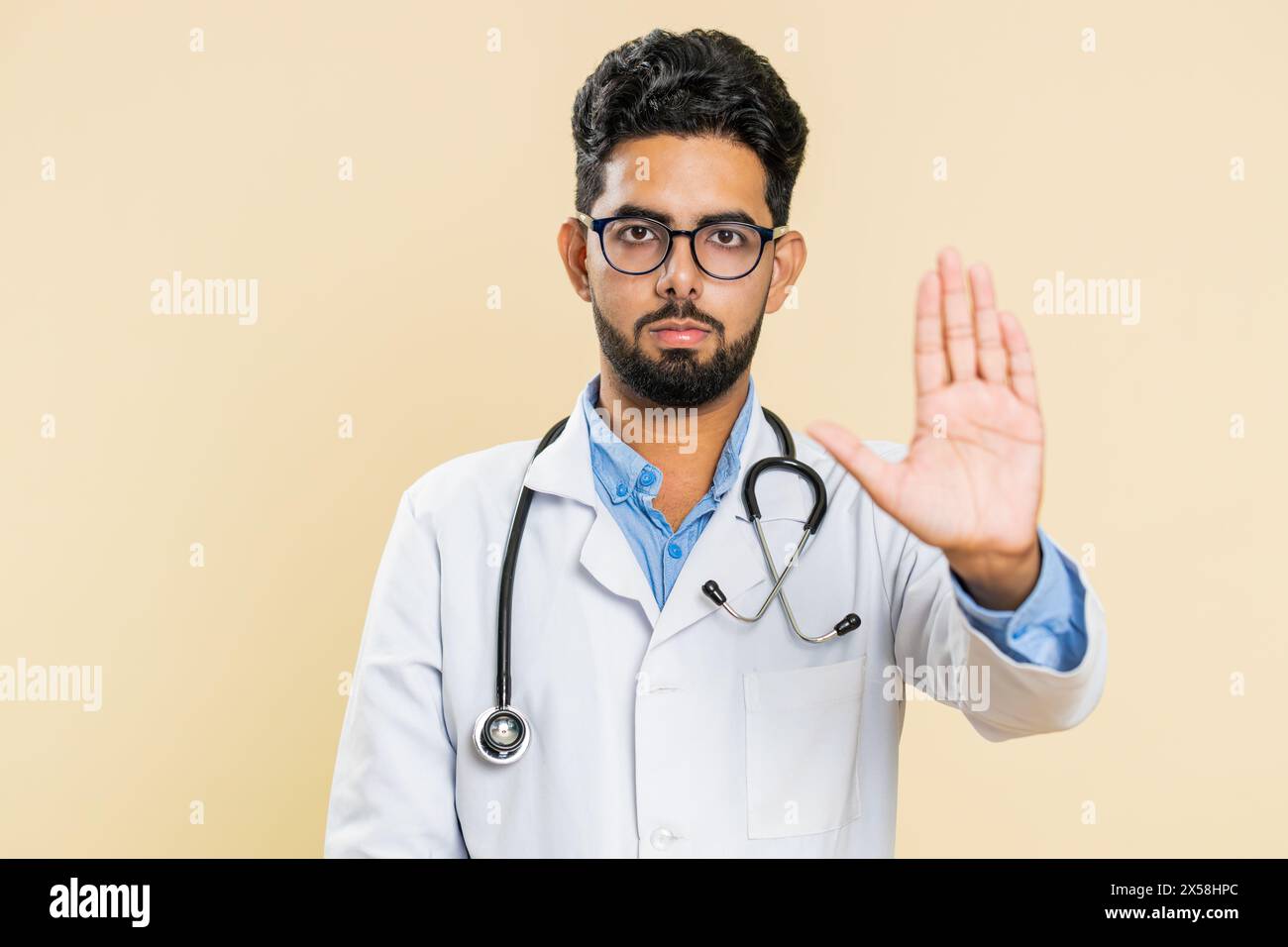 Stop, enough. Serious Indian young doctor cardiologist man say no ...