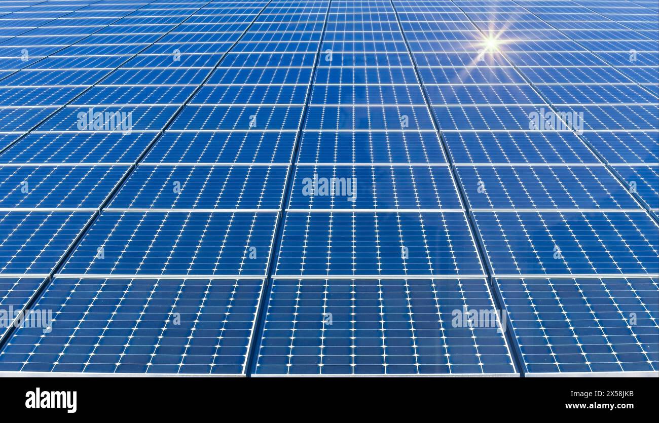 Sun reflecting off a solar panel array Stock Photo - Alamy