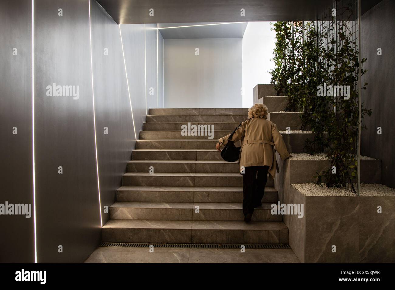 Elderly woman climbing pedestrian underpass stairs Stock Photo - Alamy