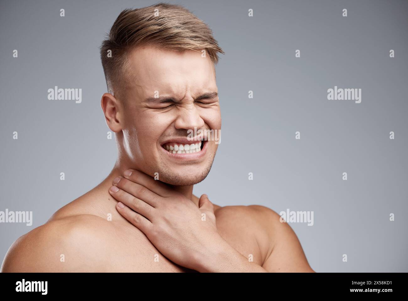 Studio background, neck pain and man with stress tension or injury of ...