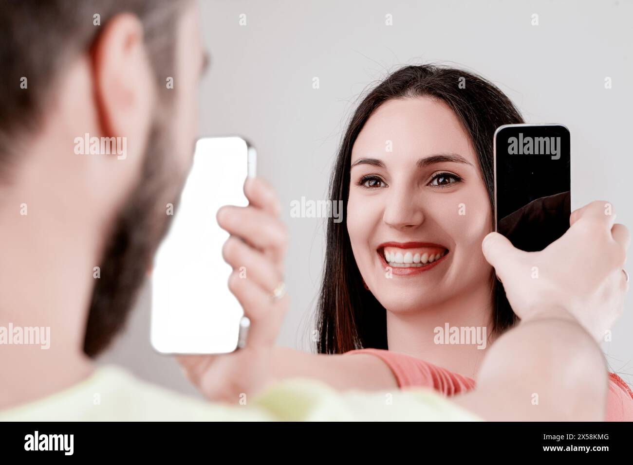 Animated display of smartphone content between a man and woman, using ...