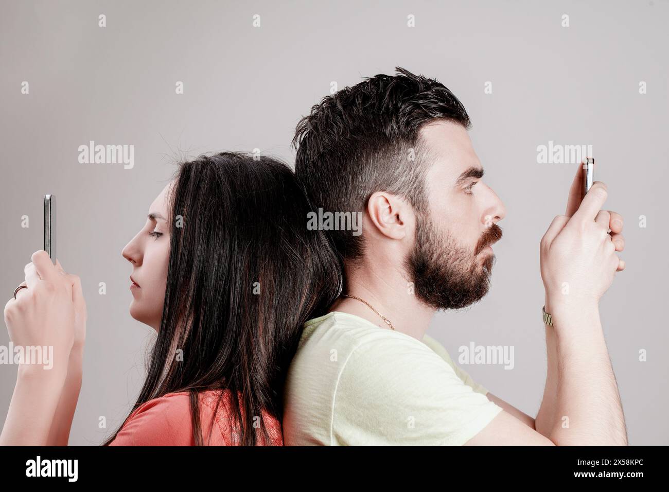 Despite physical closeness, a man and woman focus solely on their ...