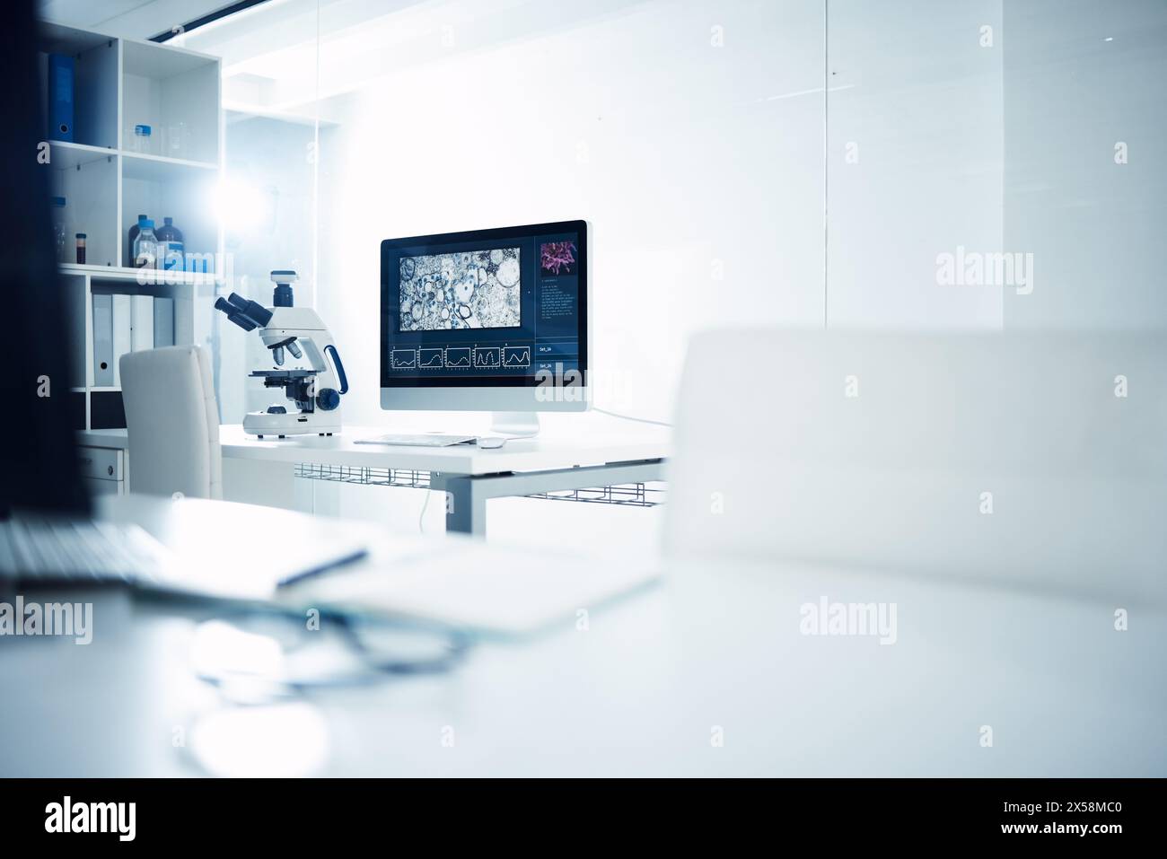 Empty, room and microscope with computer in laboratory for medical ...