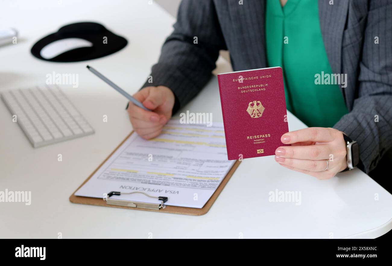 Top view close up of a caucasian woman filling out visa application ...