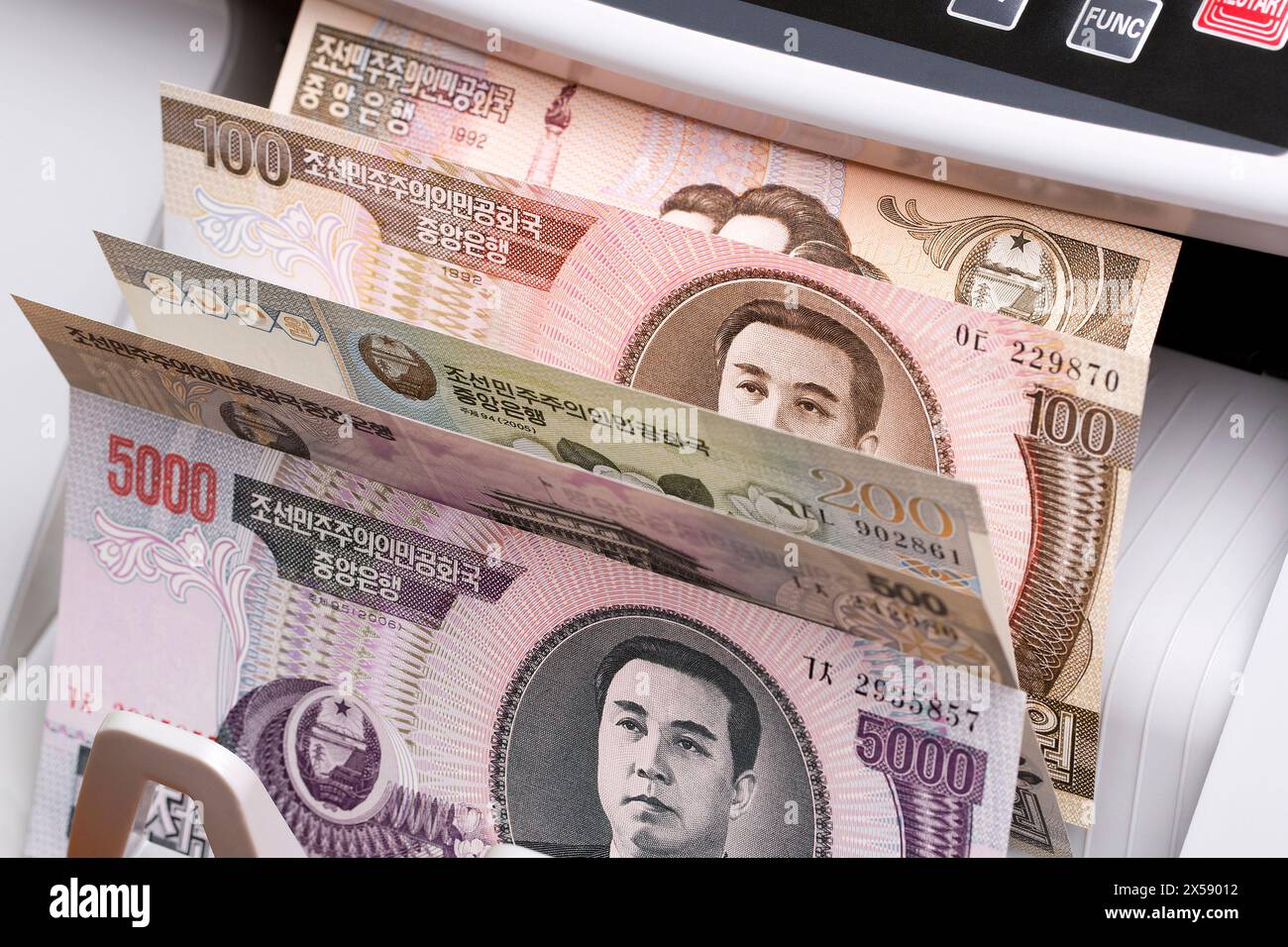 North Korean money - Won in a counting machine Stock Photo - Alamy