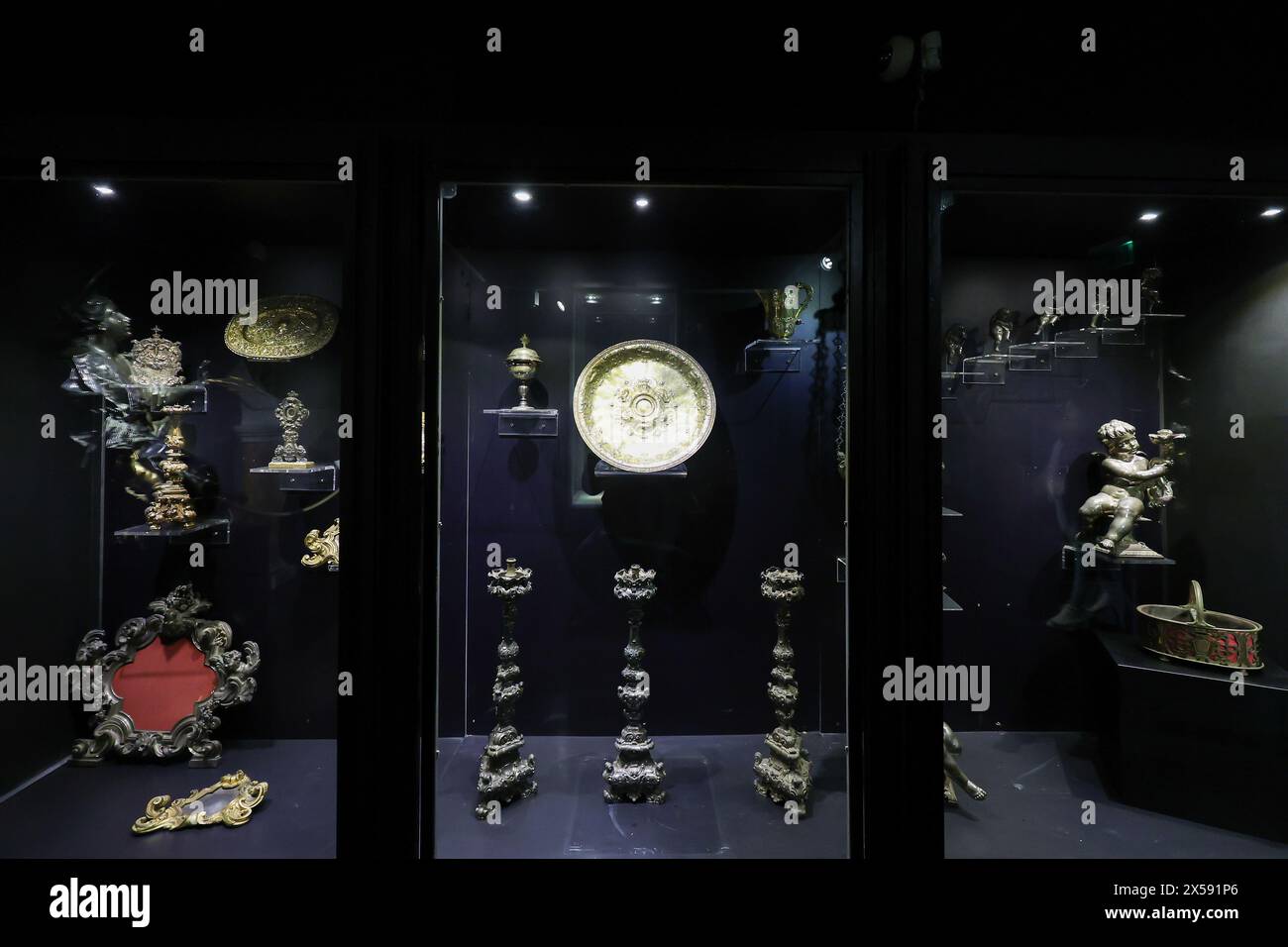 A series of precious objects in a display case inside the chapel and ...