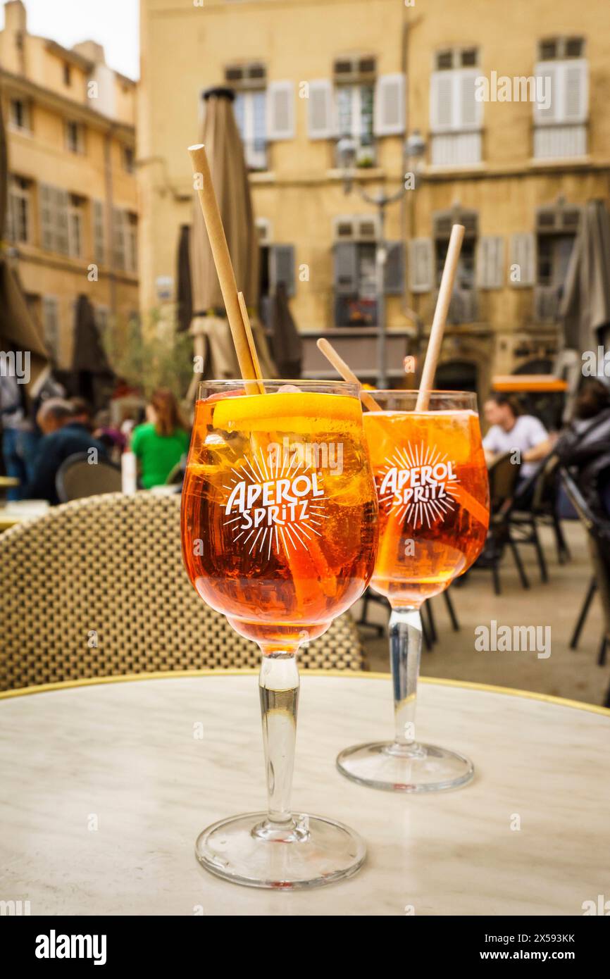 Two glasses of Aperol Spritz at a pavement cafe in a traditiaonal ...