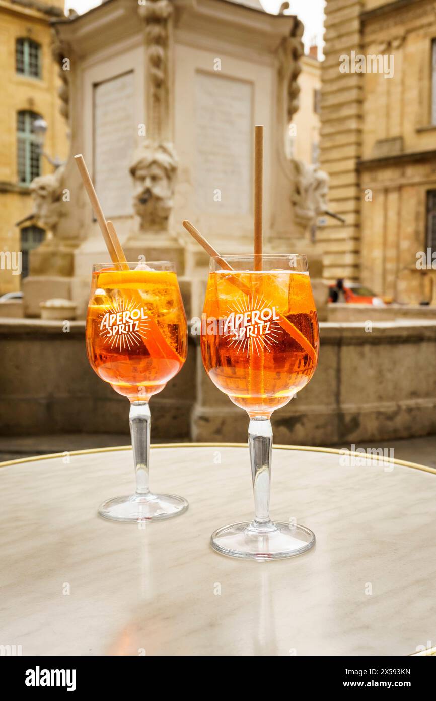 Two glasses of Aperol Spritz at a pavement cafe in a traditiaonal ...