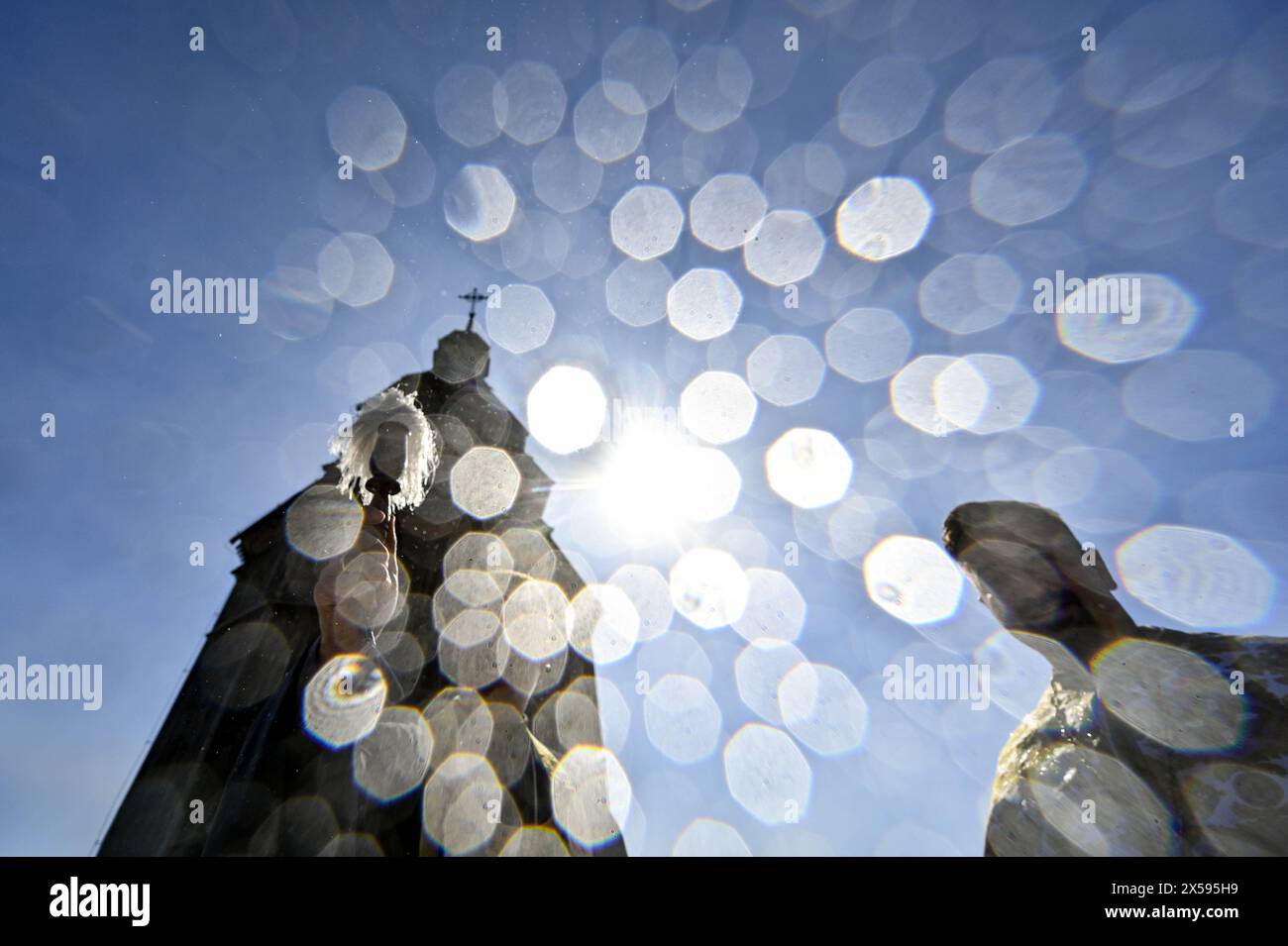 Non Exclusive: ZAPORIZHZHIA, UKRAINE - MAY 5, 2024 - Priests sprinkle ...