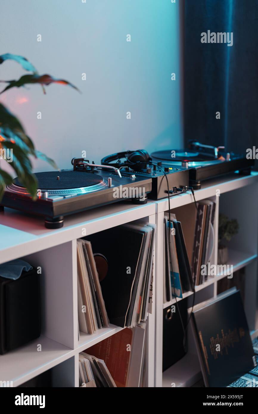 Modern turntable and vinyl collection in stylish interior Stock Photo ...