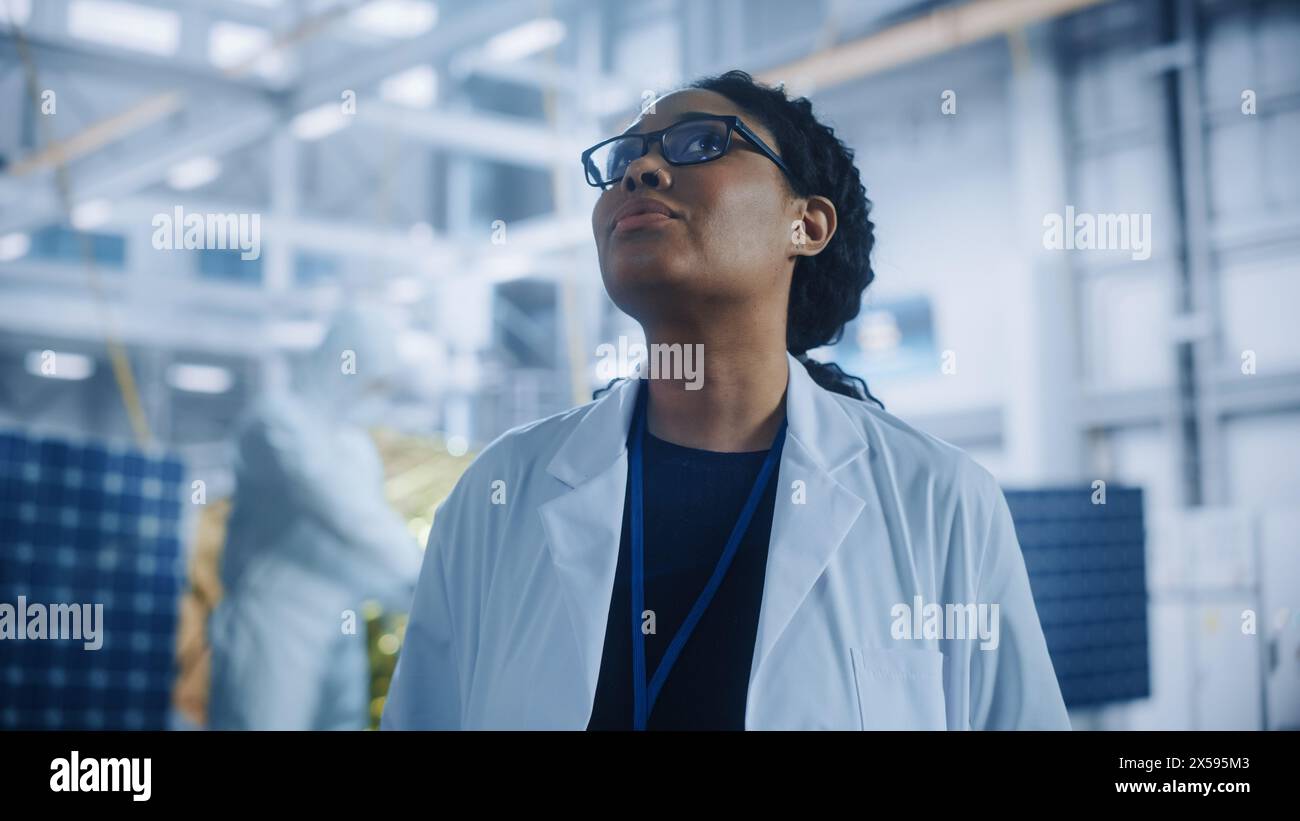 Brilliant Female Engineer Looking Around in Wonder at the Aerospace ...