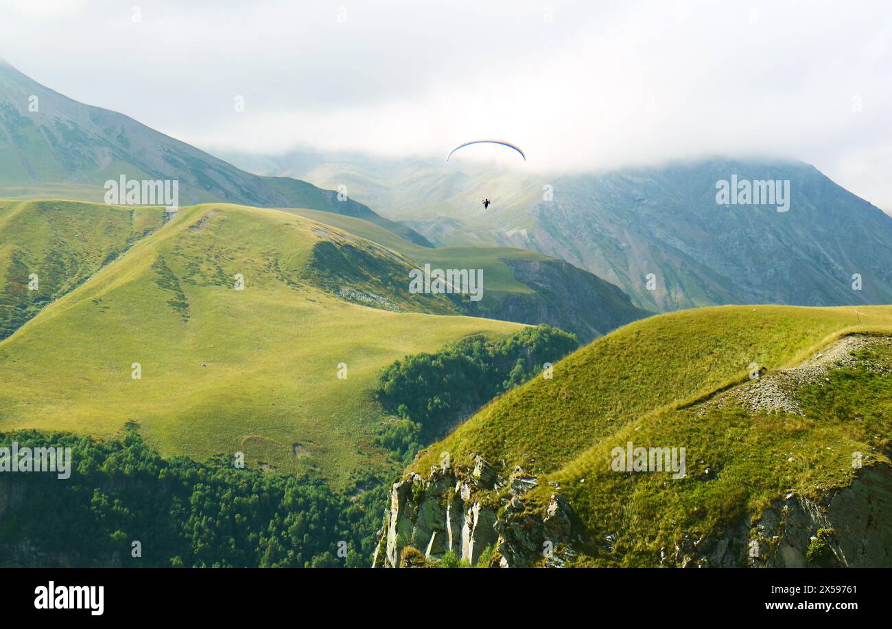 Paragliding over the Lush Caucasus Mountain Ranges near Georgian ...