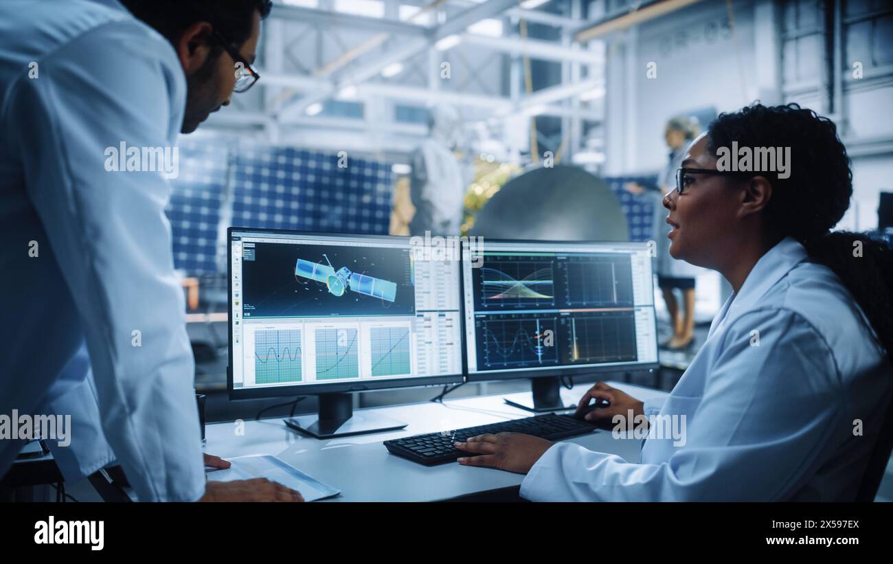 Managing Engineer and Chief Technician Working on Satellite ...