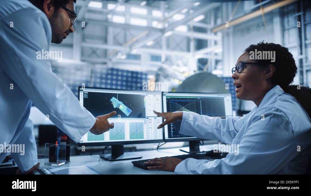 Managing Engineer and Chief Technician Working on Satellite ...