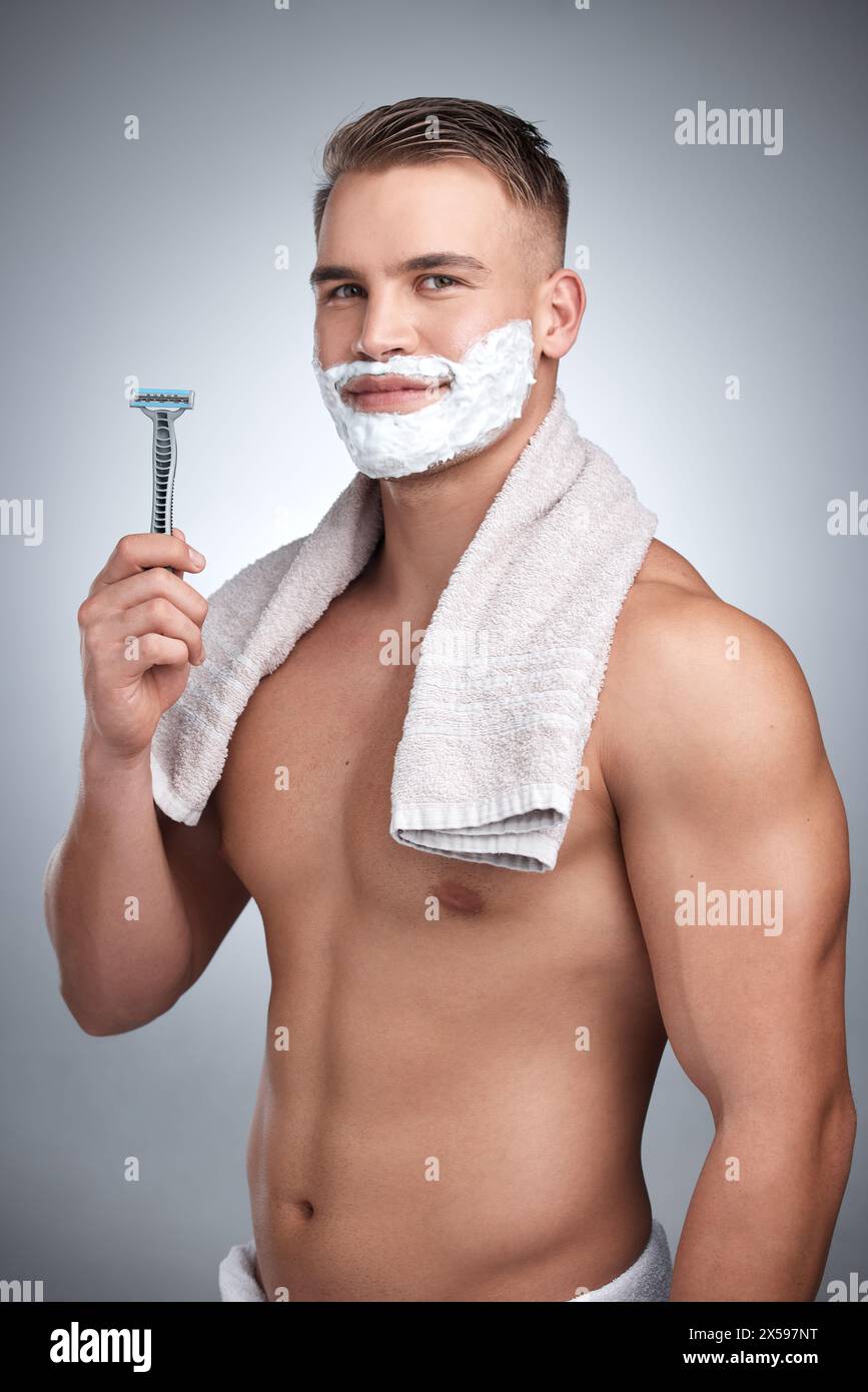 Portrait, man and razor with hair removal in studio for grooming ...