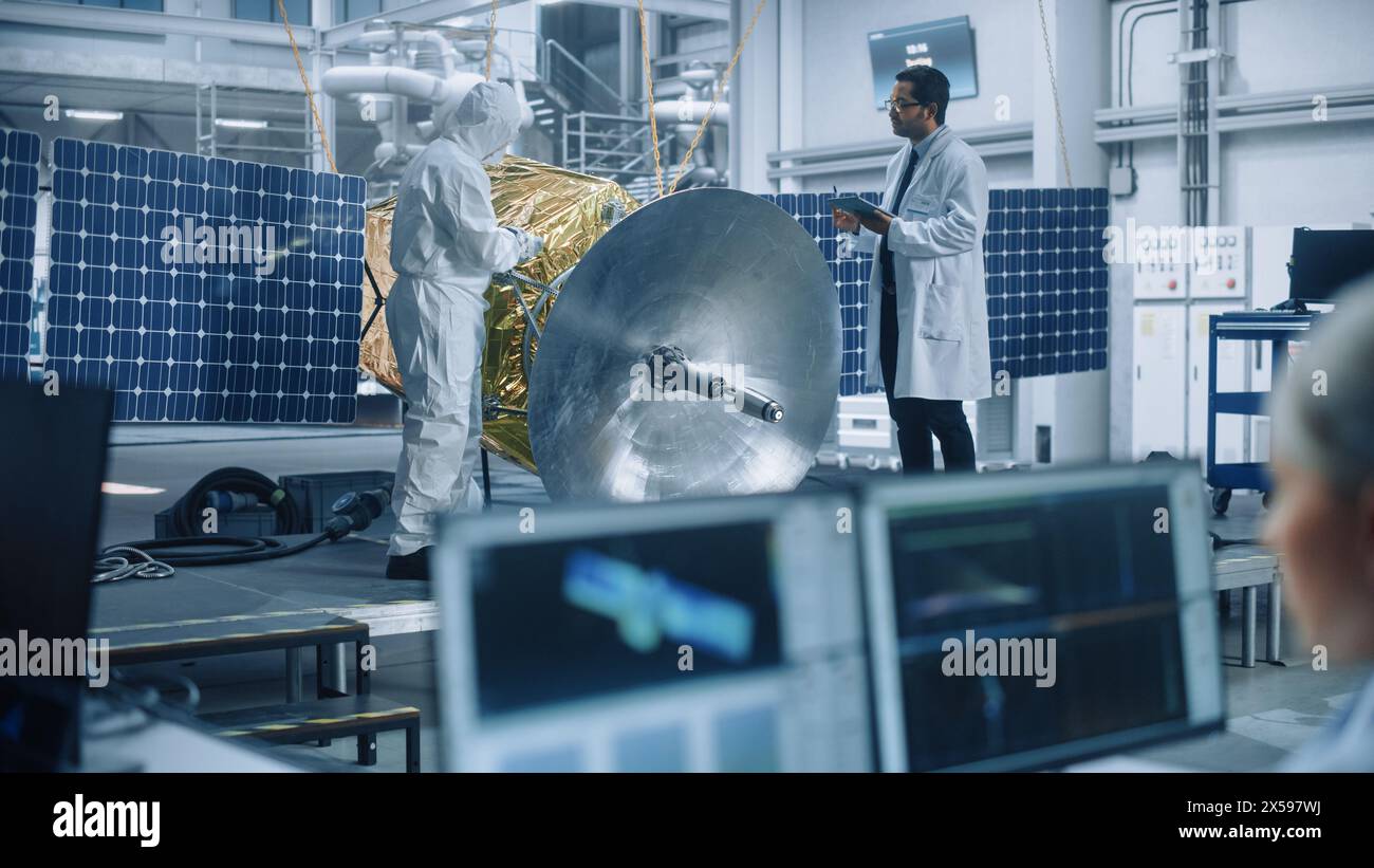 Managing Engineer and Chief Technician Working on Satellite ...