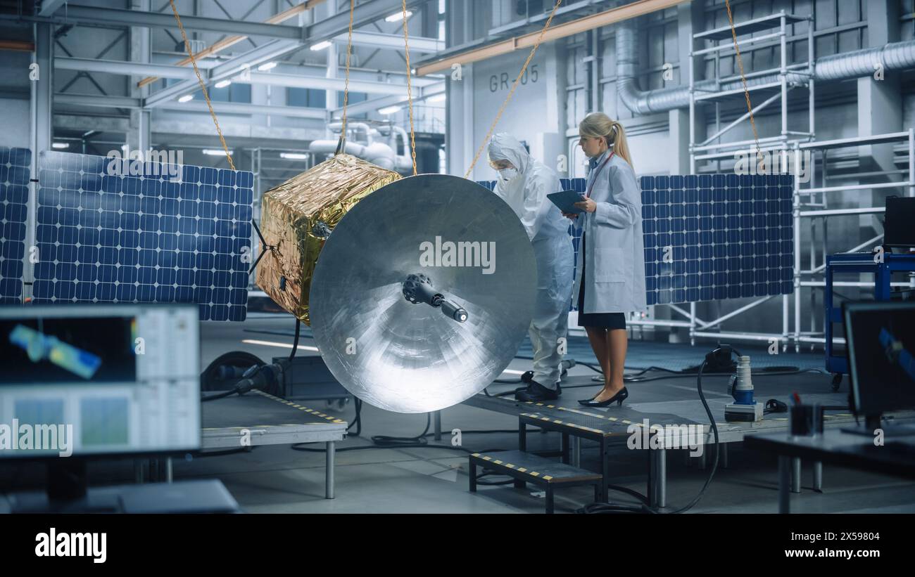Female Chief Engineer talk to Technician while he is Working on ...