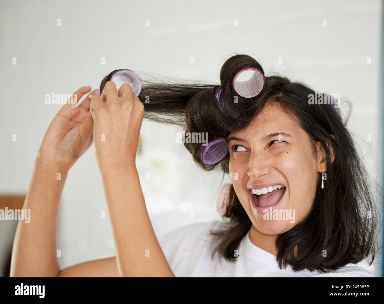 Hair, rollers and woman with damage in home for curls, hairstyle and ...