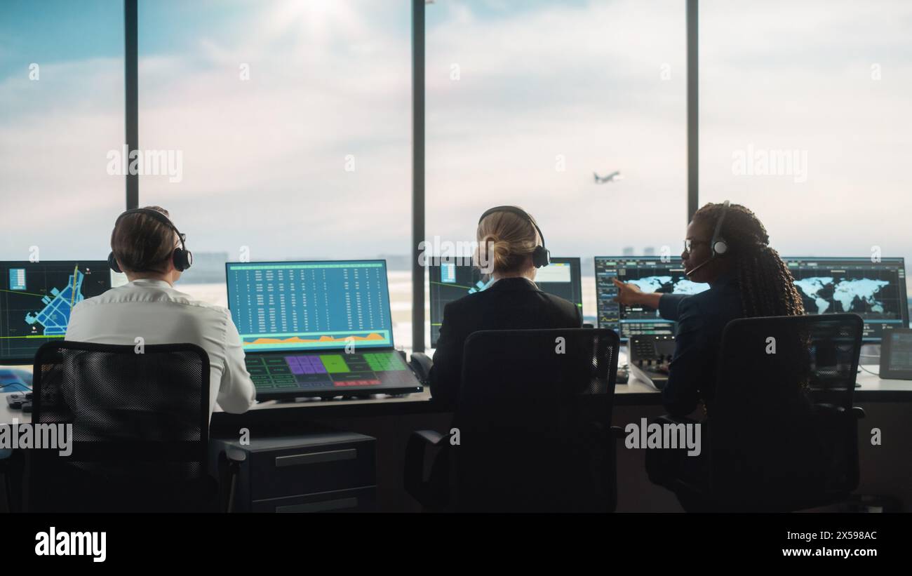 Diverse Air Traffic Control Team Working in a Modern Airport Tower ...