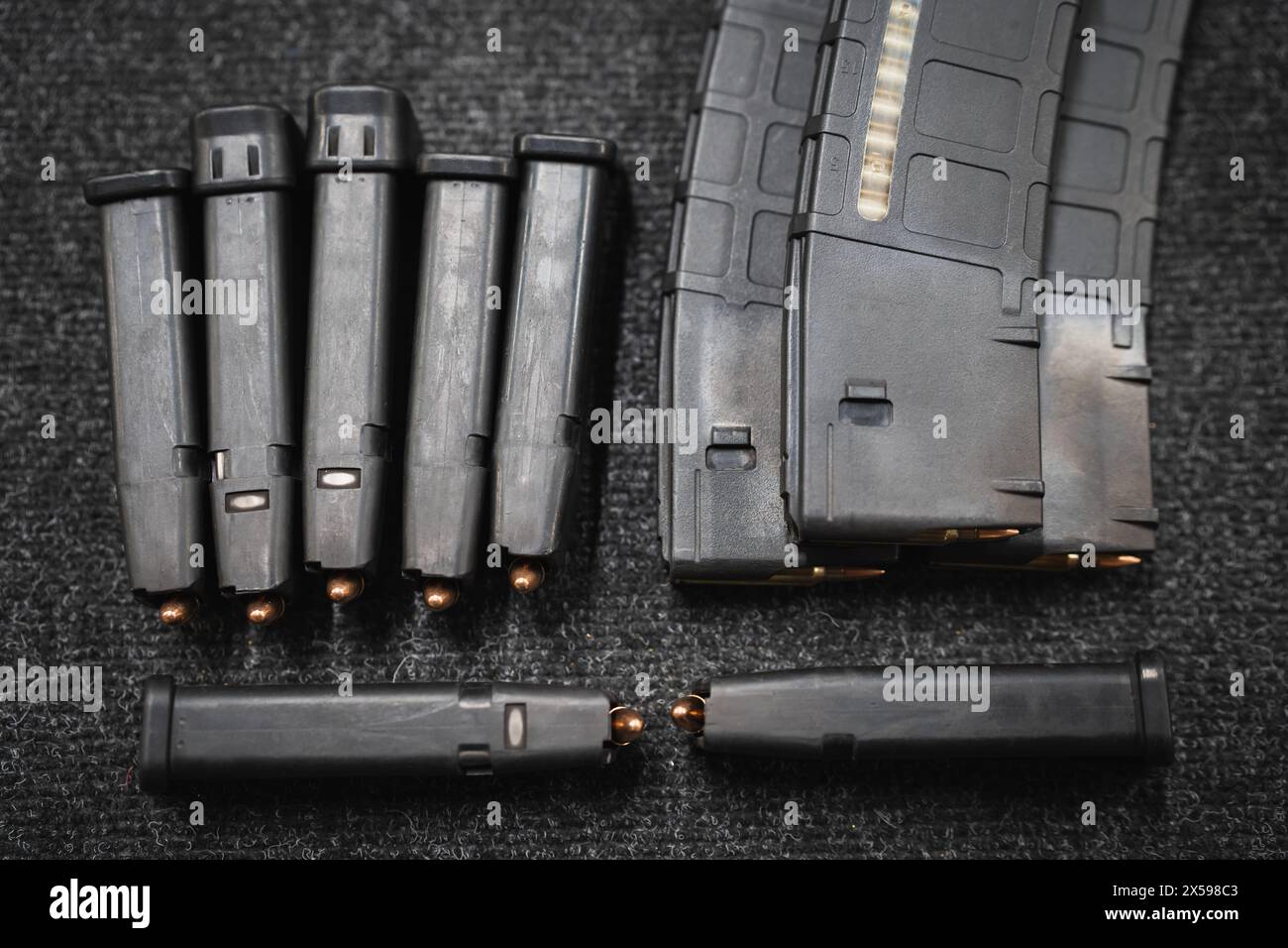 Loaded pistol and rifle magazines, close-up photo Stock Photo - Alamy