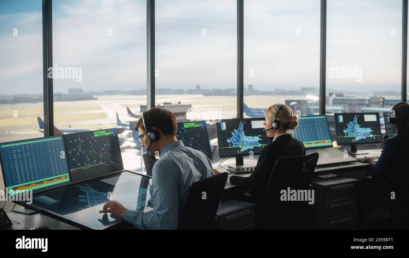 Diverse Air Traffic Control Team Working in a Modern Airport Tower ...