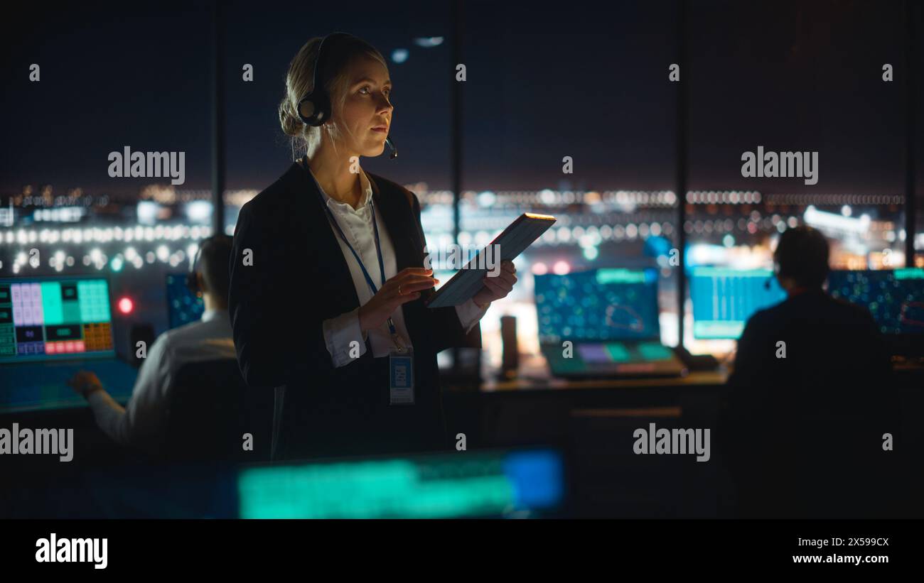 Caucasian Female Air Traffic Controller Working on Tablet in Airport ...
