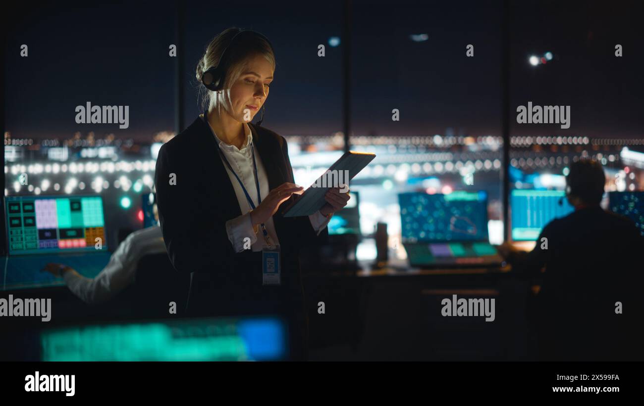 Caucasian Female Air Traffic Controller Working on Tablet in Airport ...