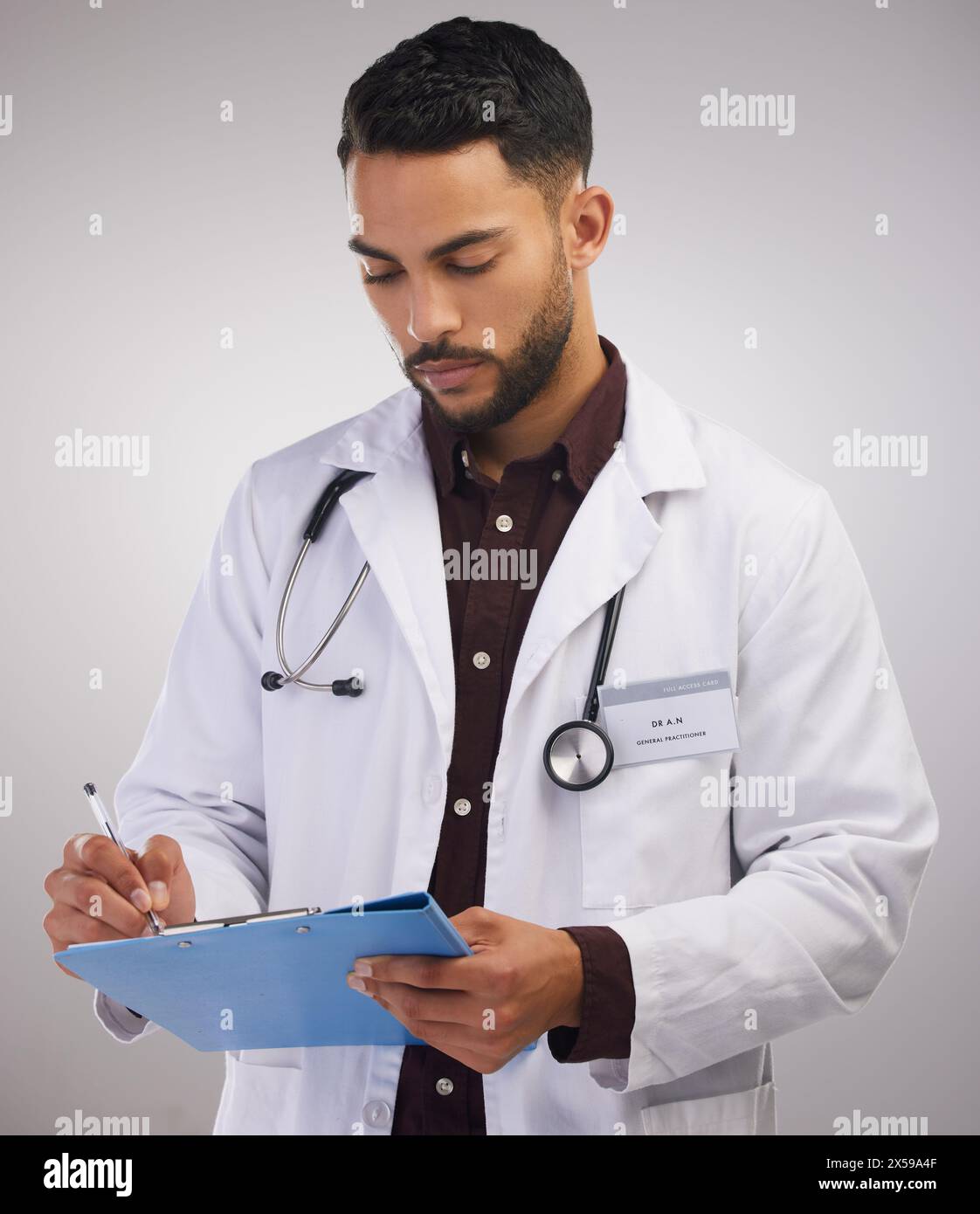Doctor, chart and writing notes in studio for healthcare, wellness or ...