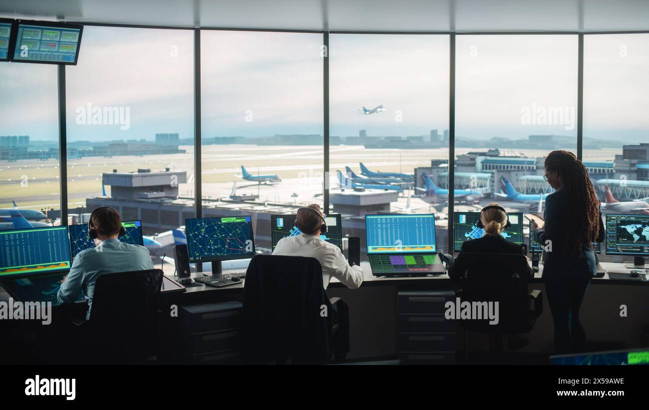 Diverse Air Traffic Control Team Working in a Modern Airport Tower ...