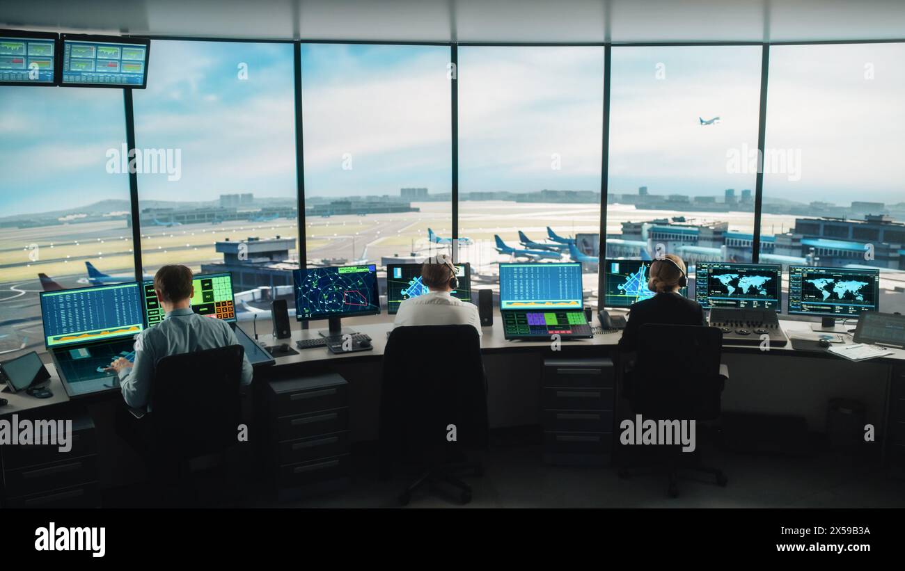 Diverse Air Traffic Control Team Working in a Modern Airport Tower ...