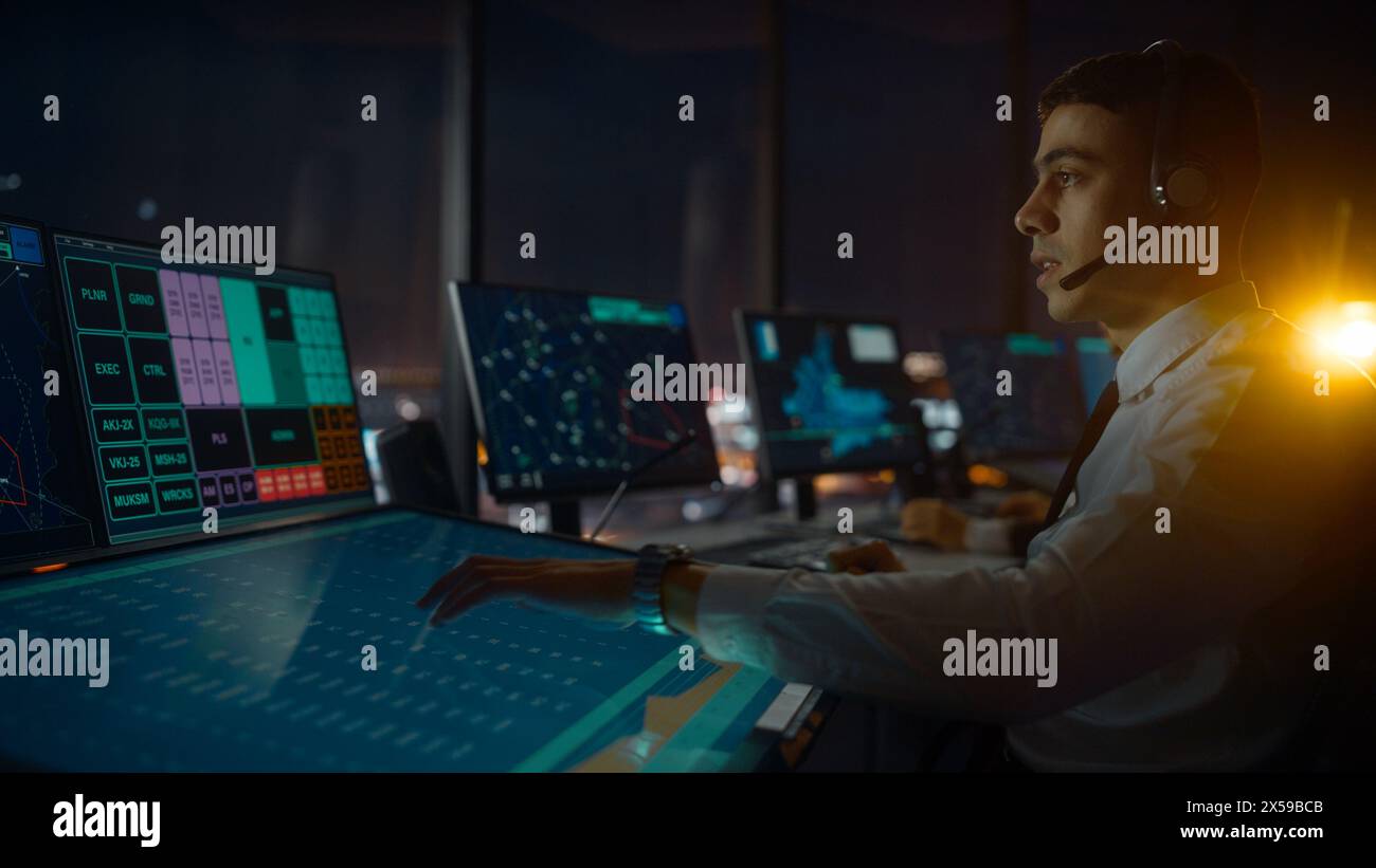 Male Air Traffic Controller with Headset Talk on a Call in Airport ...