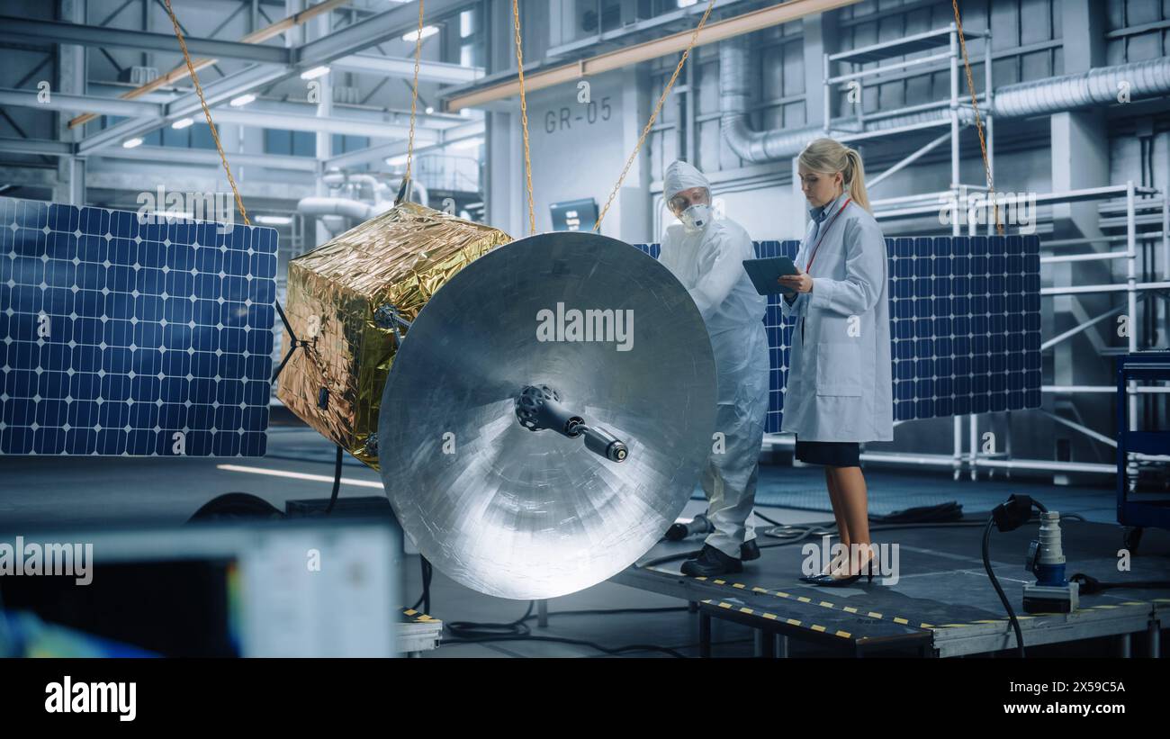 Female Chief Engineer talk to Technician while he is Working on ...