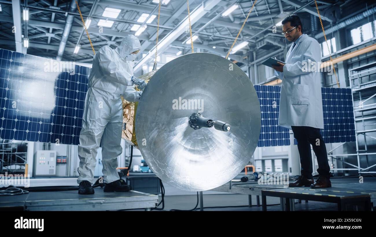Engineer and Technician Working on Satellite Construction. Aerospace ...