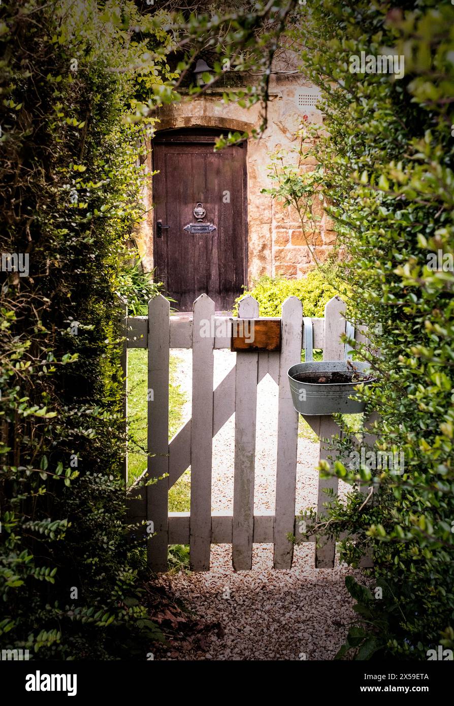 Cotswold cottage picket gate in the sleepy village of Great Tew in ...