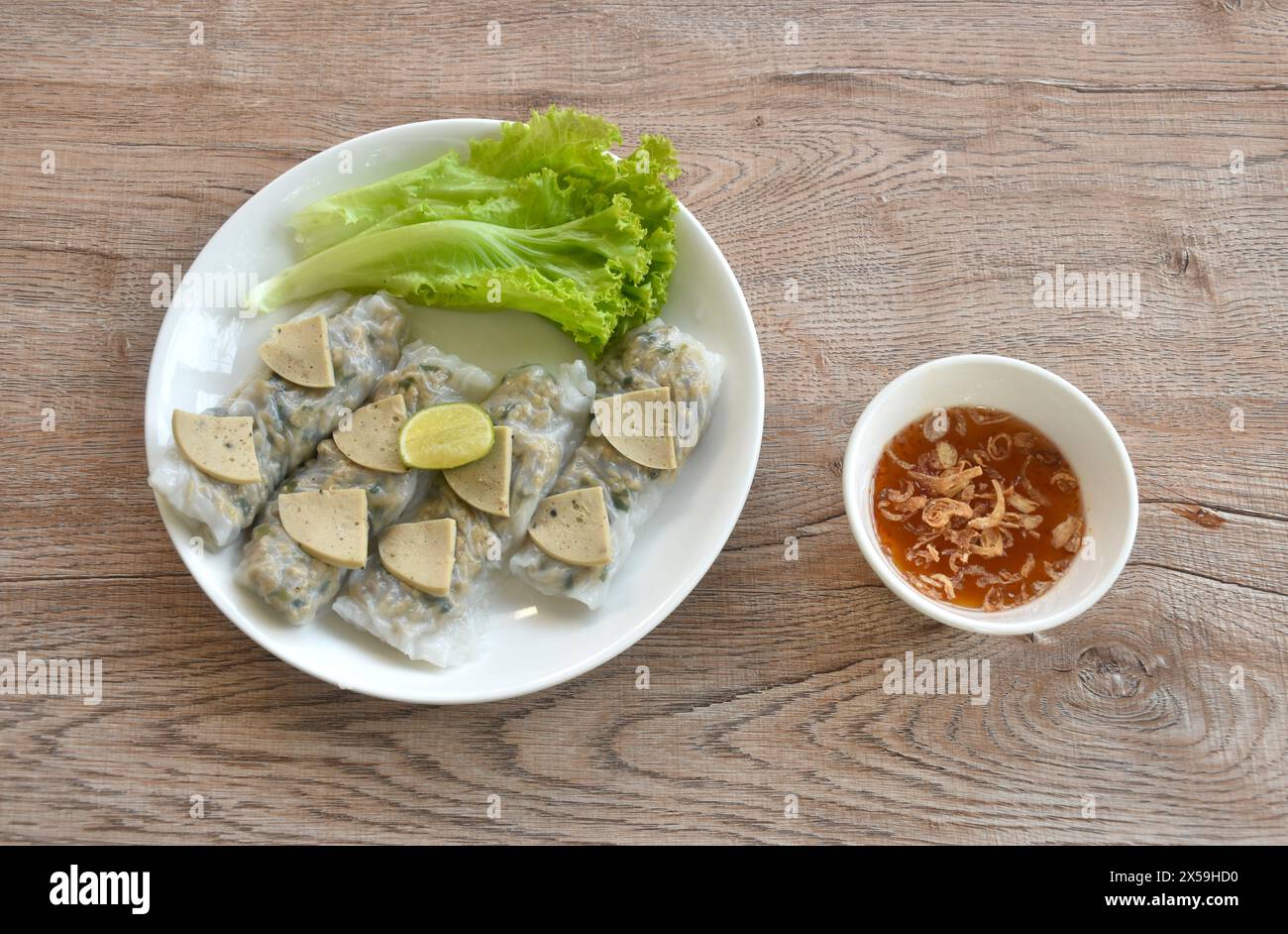 Vietnamese steamed rice dumpling stuffed chop pork and topping slice ...