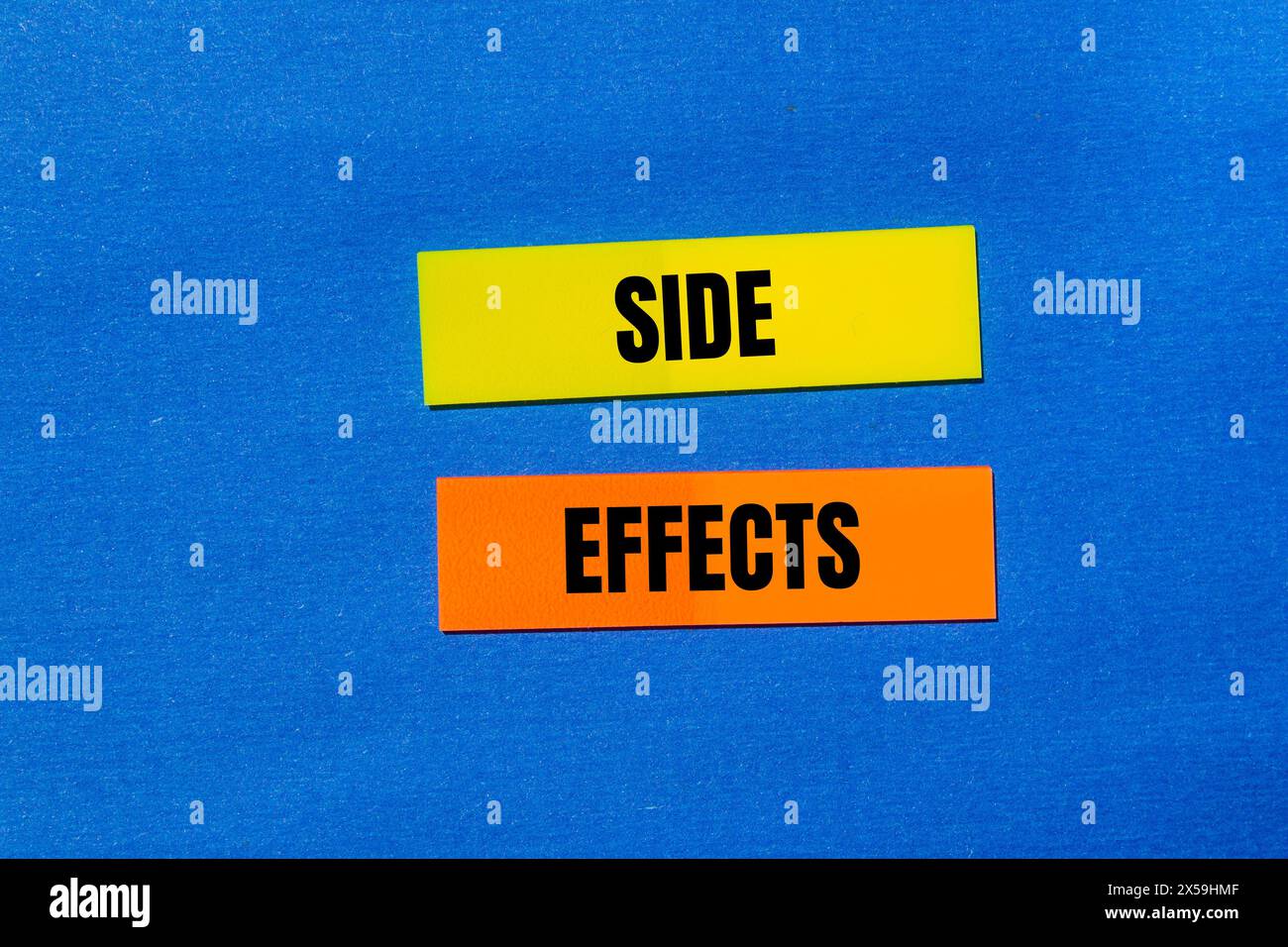 Side effects words written on paper stickers with blue background ...
