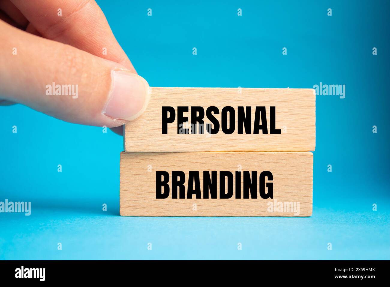 Personal branding words written on wooden blocks with blue background ...