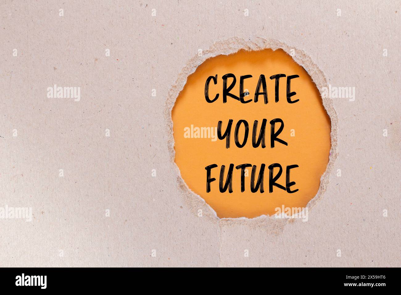 Create your future words written on ripped paper with orange background ...